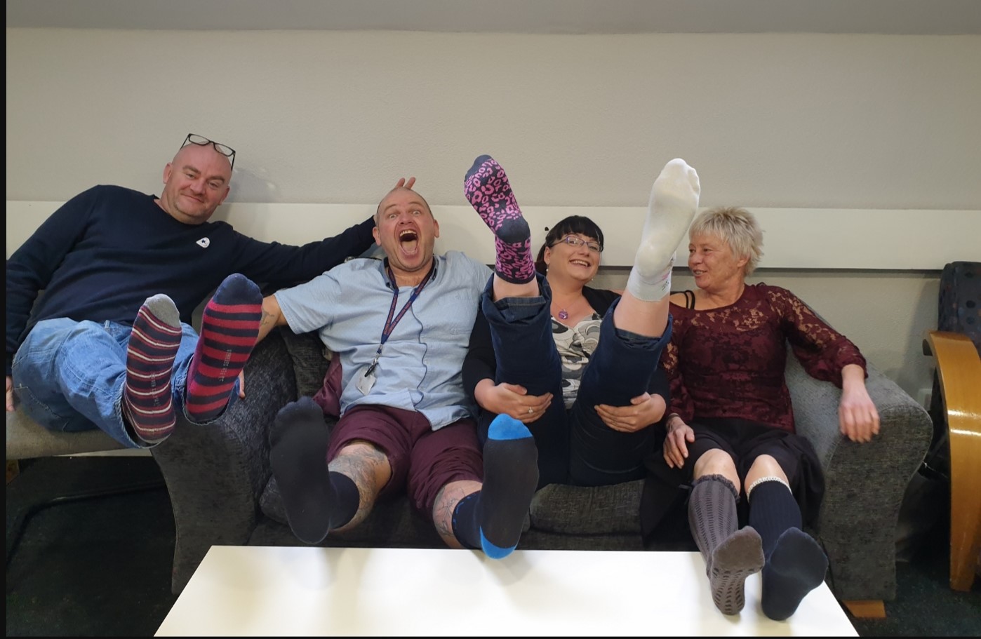 Acorn Recovery Projects staff wear odd socks for World Down Syndrome Day - Acorn